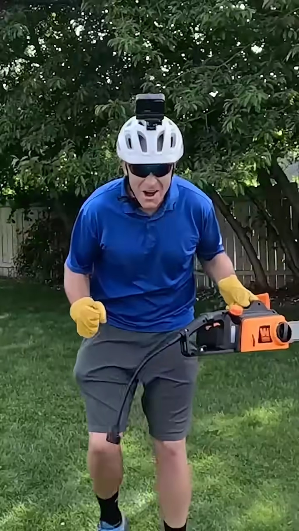 Daredevil dad balances running chainsaw on chin to break world record ...