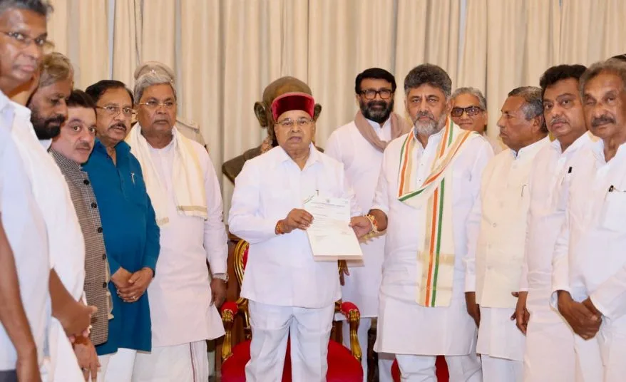 DK Shivakumar meets Karnataka governor, stakes claim to form govt ...