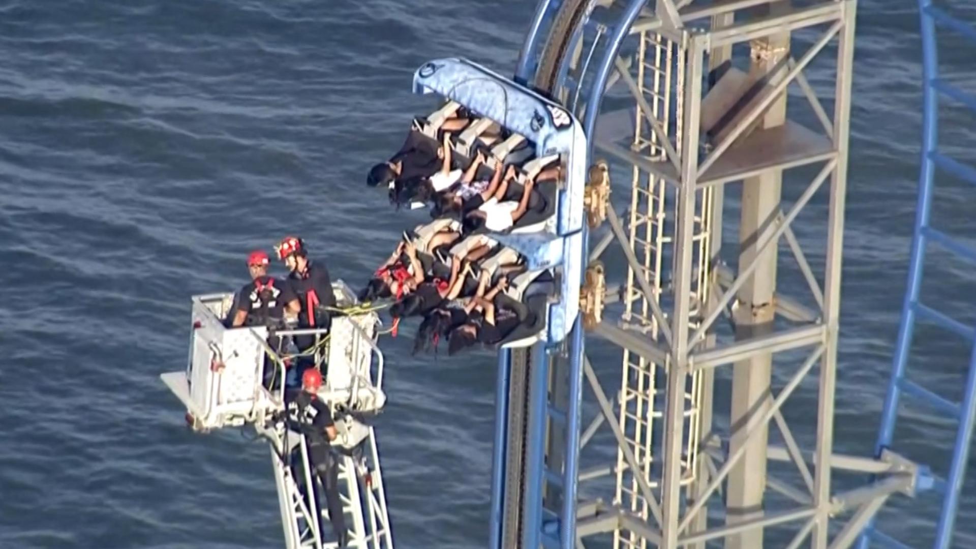 Riders rescued from Texas rollercoaster after hanging backward for hours