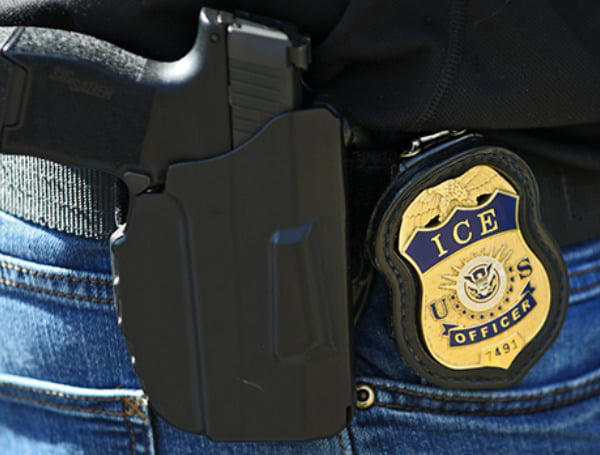 Fired through a Minnesota door: ICE agent arrested for alleged shooting ...