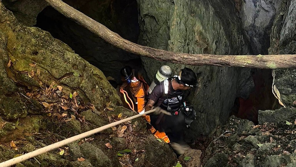 Heavy rains threaten to delay search for two people missing in Laos cave