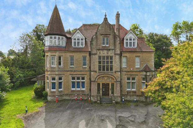 Office that could become ten bed home with tower on the market for £1 ...