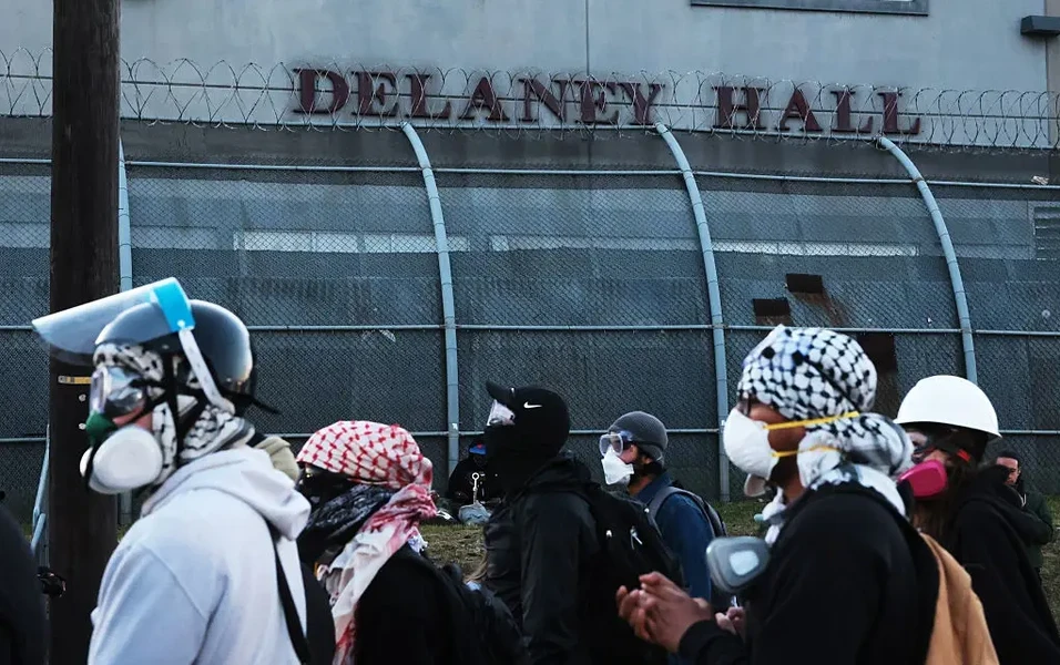 Protester charged in violent clash with ICE officers