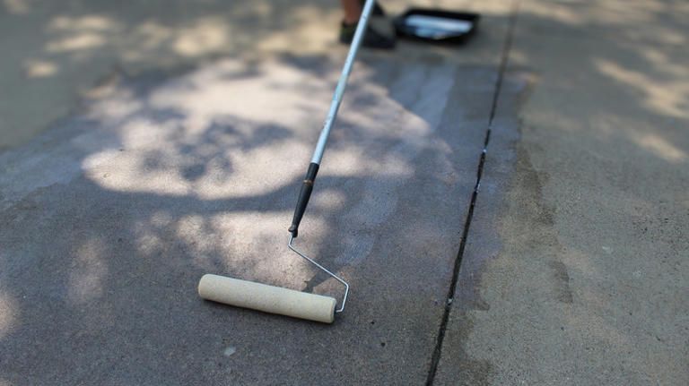 Want to keep oil or other fluids from staining your driveway? This may ...