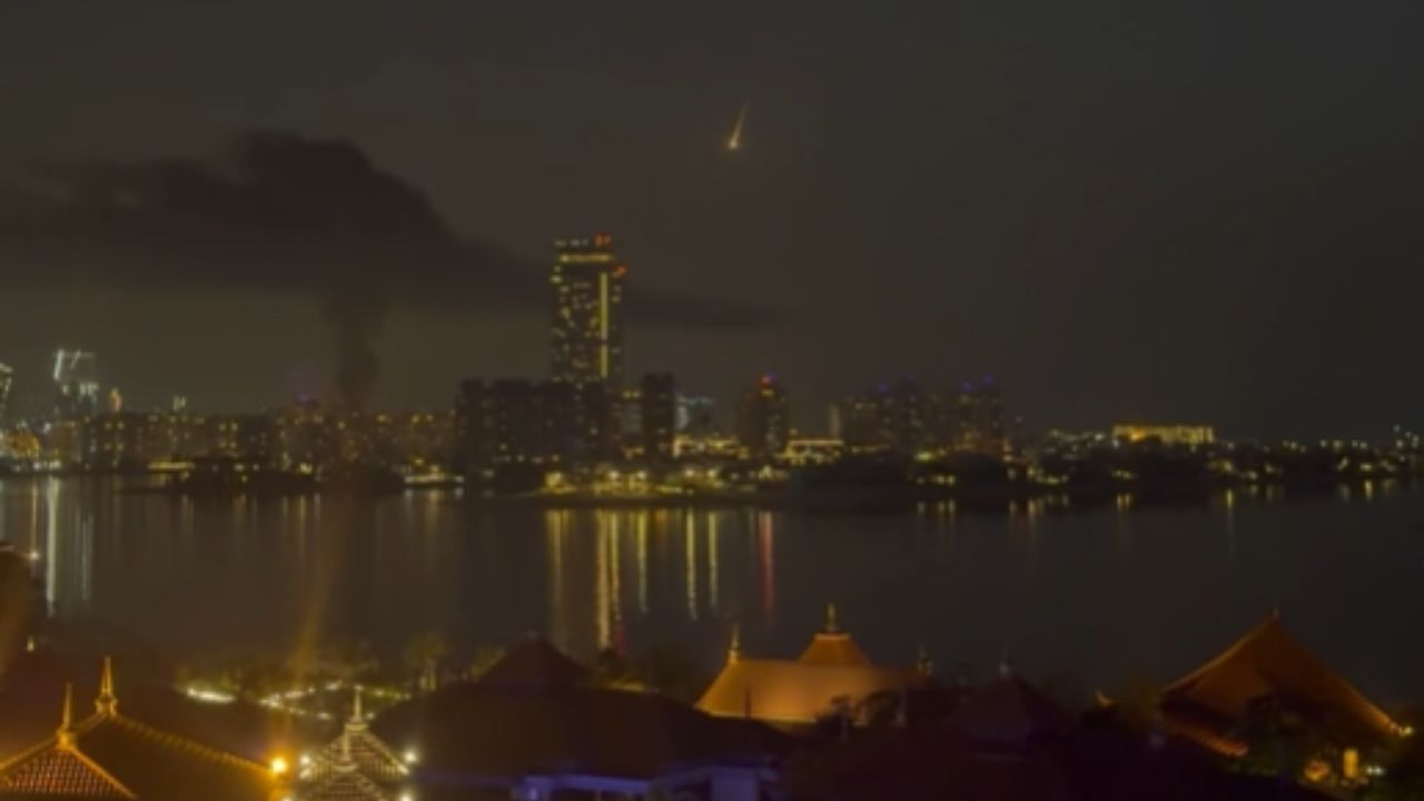 Rocket flies across Dubai sky leaving bright trail above city lights