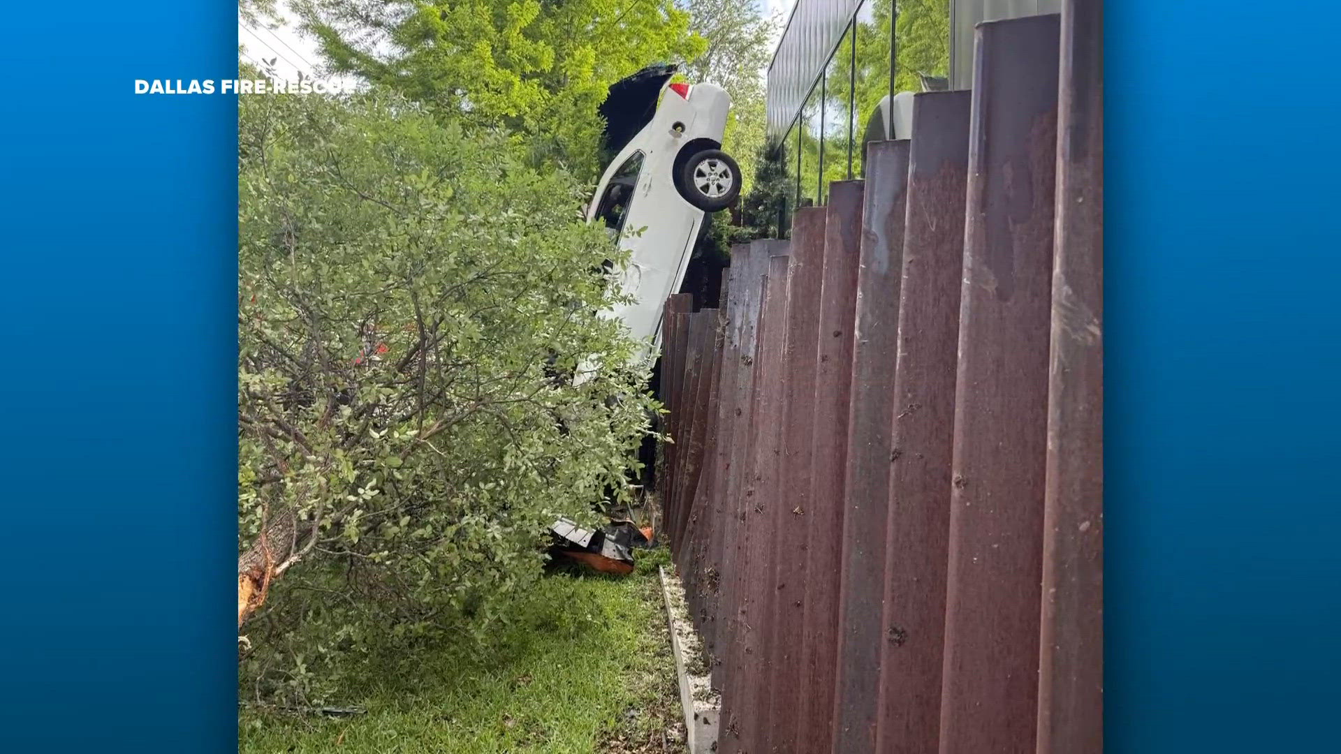 Dallas firefighters rescue driver after car crashes between fence, tree ...