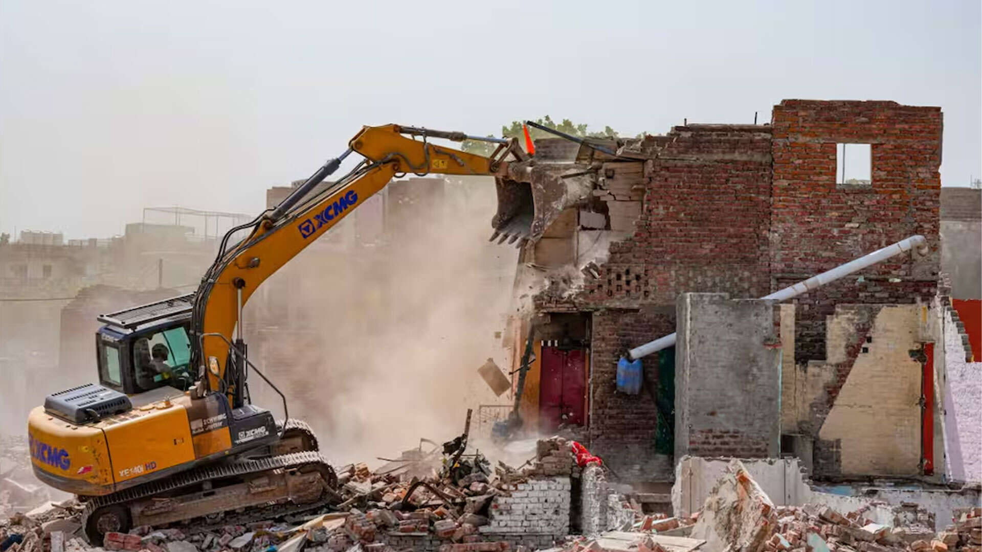 Heavy security deployed as authorities begin road-widening demolition ...