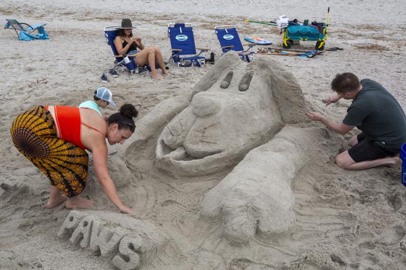 Architects, families take to Front Beach on IOP for Spoleto sand ...