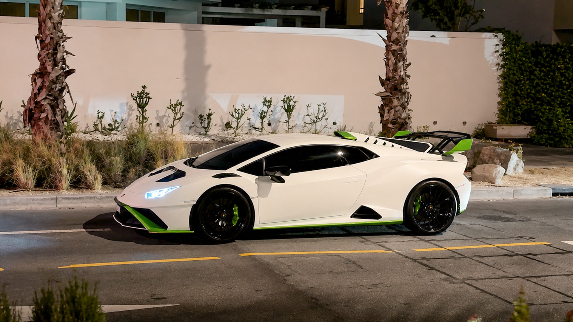 Millionaire enjoying a Lamborghini Huracán STO after dark