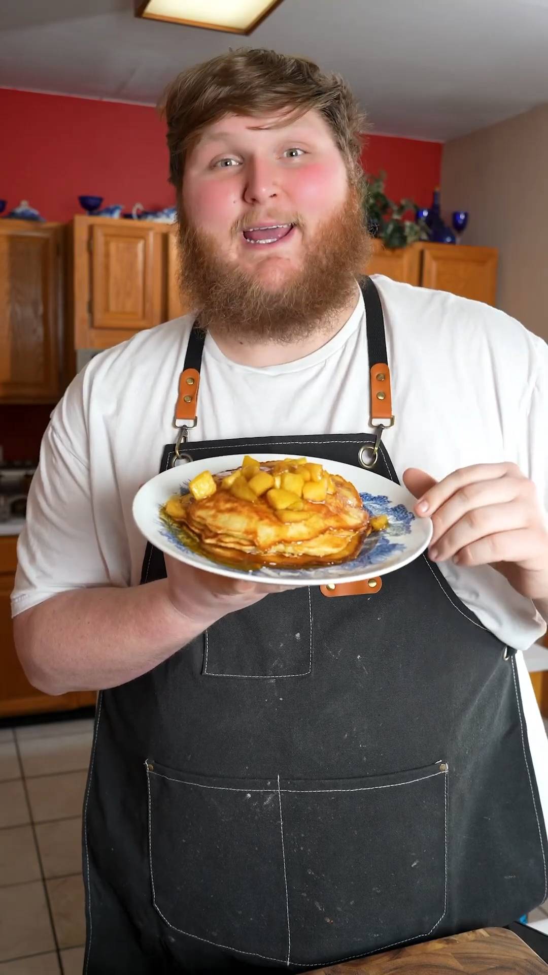 Fluffy apple cinnamon pancakes with maple syrup and butter
