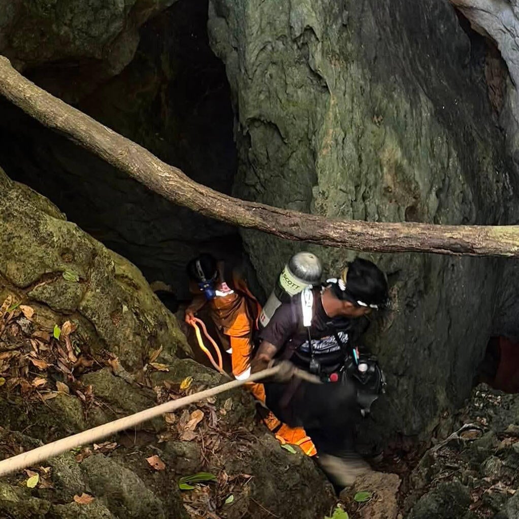 Rain threatens search for 2 gold miners still missing in Laos cave