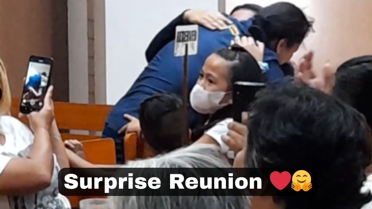 Woman serves the meal in a cap and mask before the big moment