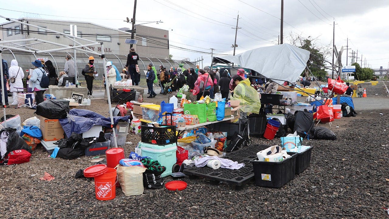 Agitators outside Delaney Hall set up organized logistics operation ...