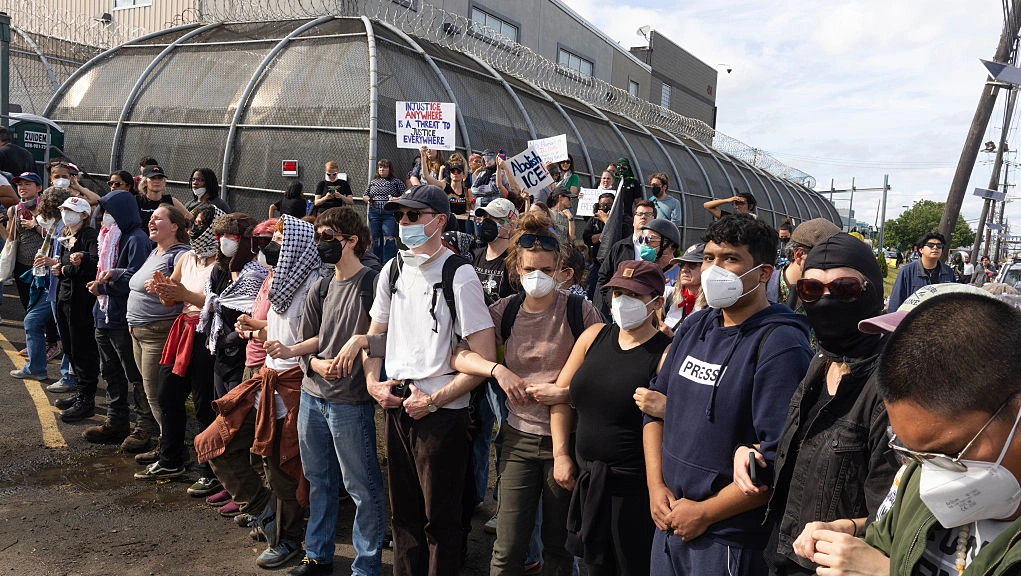 Protester charged in violent clash with ICE officers