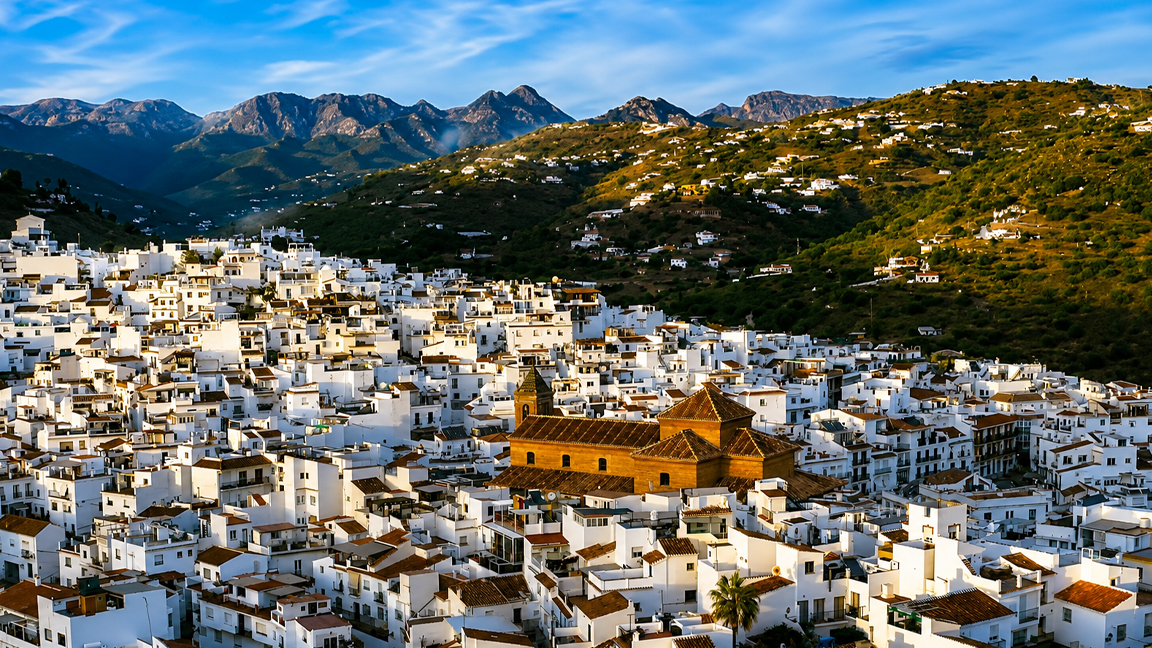 Thousands of white buildings packed beneath dangerous peaks