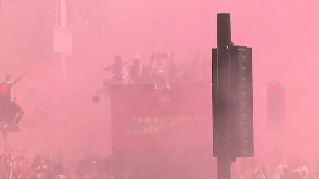 Arsenal parade battles though thick clouds of red pyro smoke