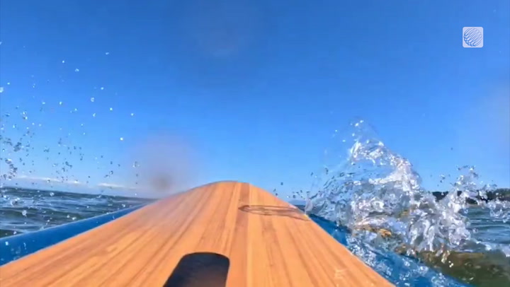 Riding the choppy waves at Centennial Beach