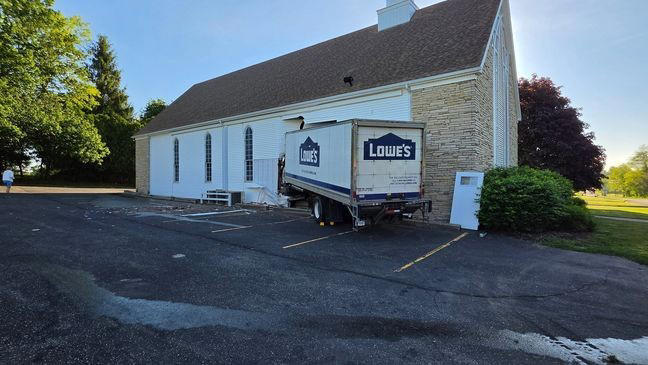 Two hurt after Lowe's box truck driver crashes into church in Grand Rapids