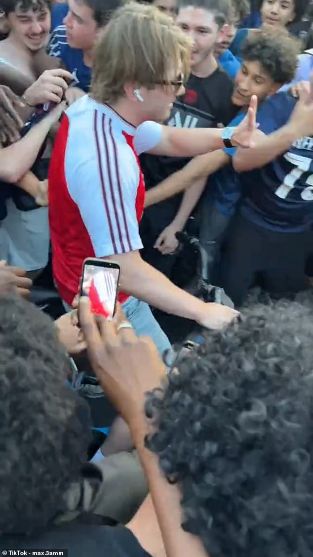 Harrowing moment lone Arsenal fan in Paris is mobbed and roughed up by ...