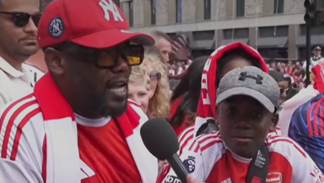 Arsenal fans turn streets red for victory parade