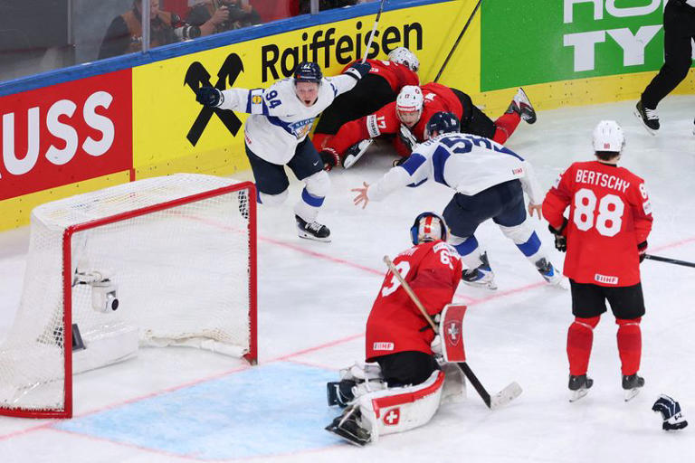 Ice hockey-Helenius is the hero as Finland beat Swiss in world final
