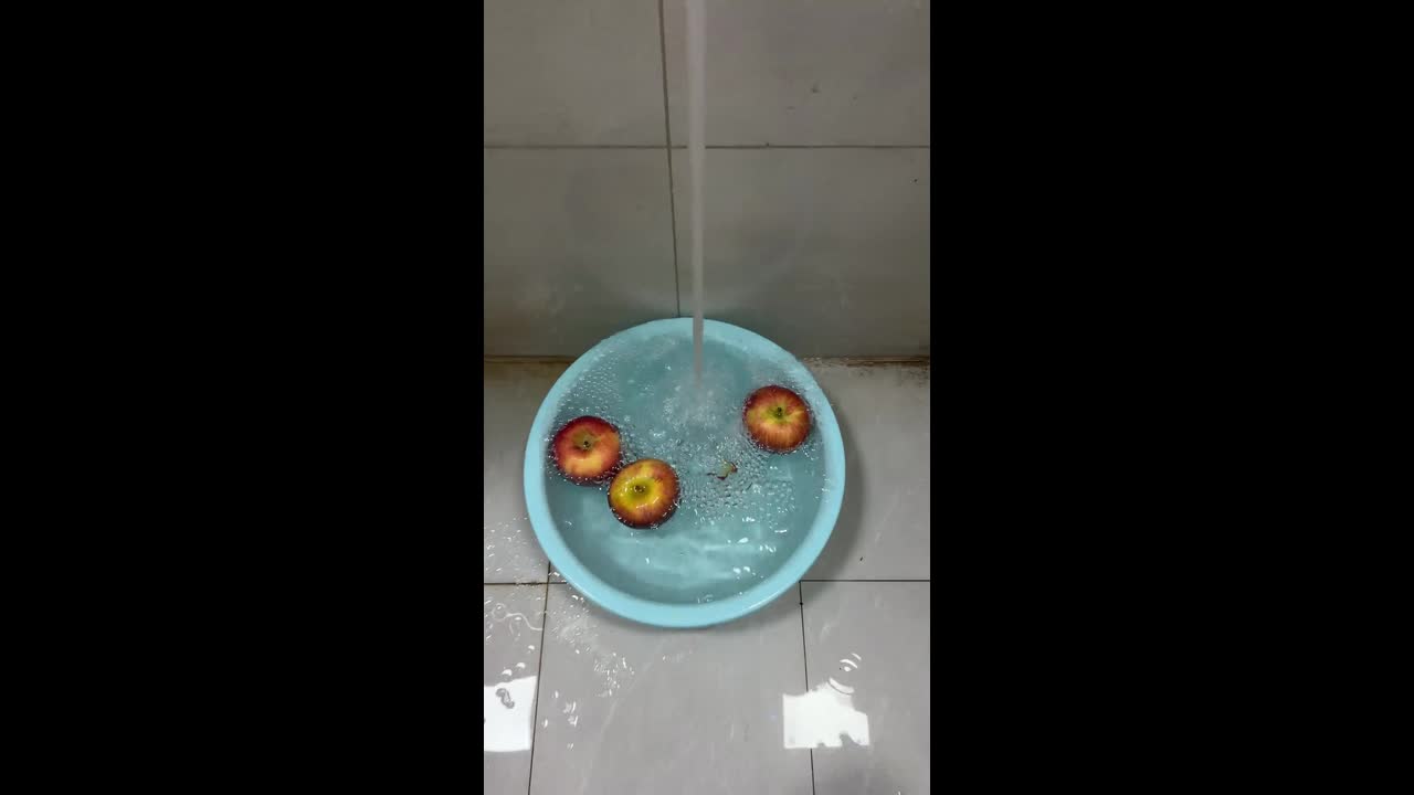 Apple appears to float beneath running water physics demonstration in ...