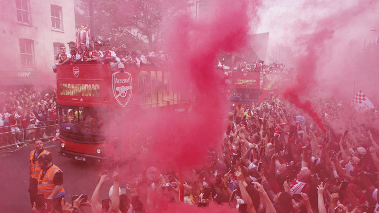 Arsenal fans turn streets red for victory parade