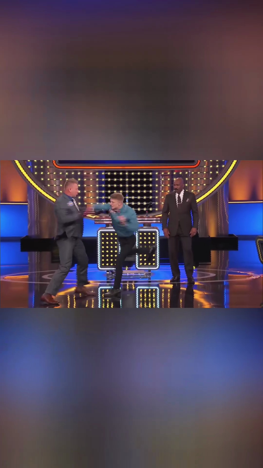Steve Harvey watches Family Feud fight break out