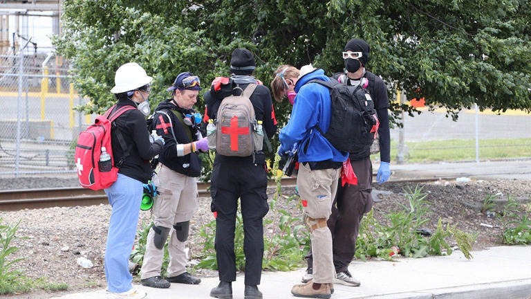 Agitators outside Delaney Hall set up organized logistics operation ...