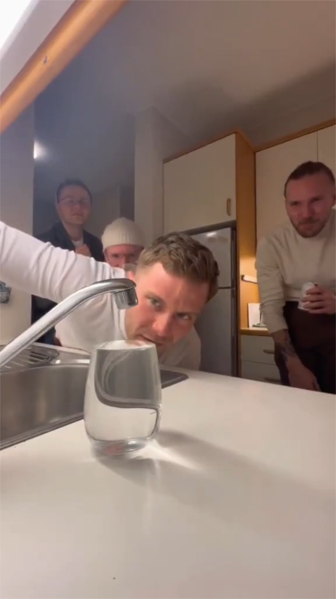 Guys Play Game Trying Not To Spill Over Water In A Glass and It Is Intense