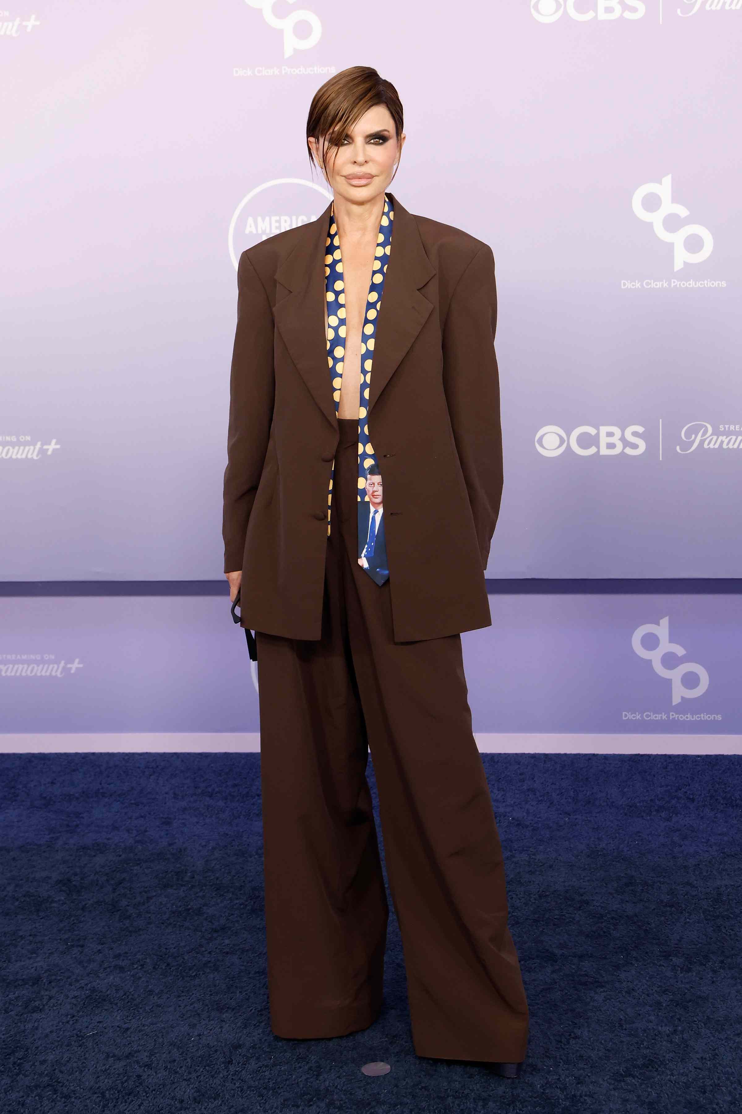 Lisa Rinna swaps her signature pixie cut for a towering beehive updo ...