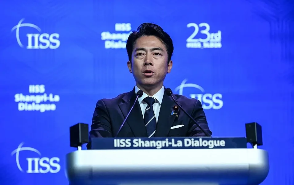 Japan rejects 'new militarism' label, warns over China's arms build-up