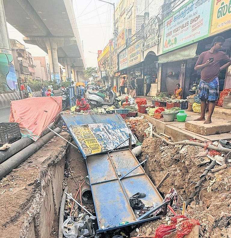 Broken pathways and open pits greet commuters on TH Road