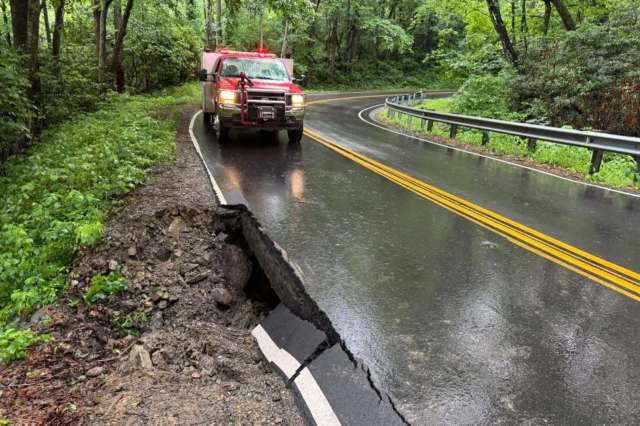Torrential rain opens 12-foot hole beneath North Carolina highway as ...