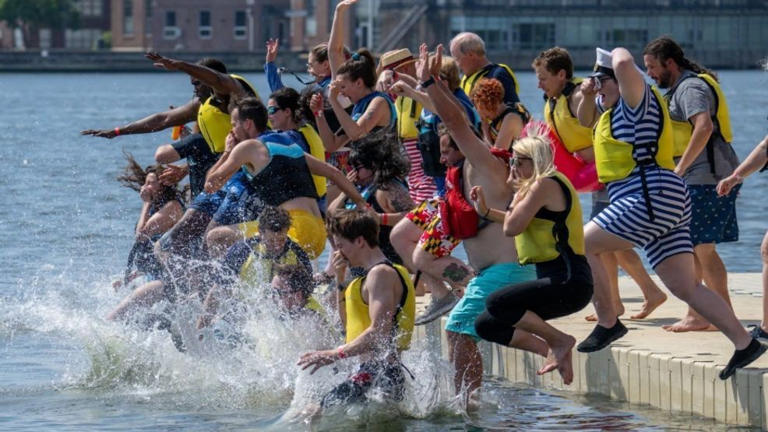 Sun: Baltimore swimmers take on Harbor Splash as water hits 'tipping point'