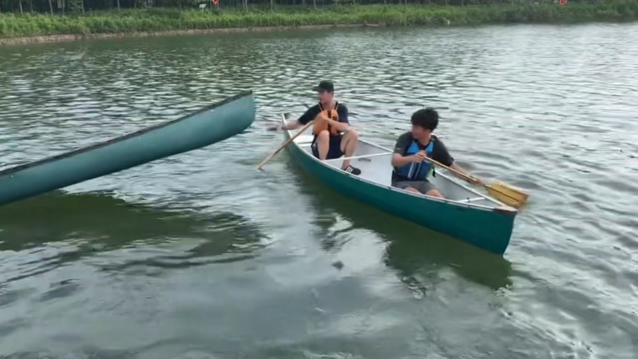 Canoe riders pull off incredible boat-crossing trick in Shanghai