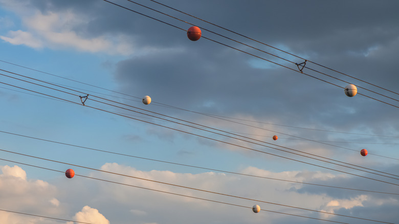 The reason power lines have orange balls is almost as interesting as ...