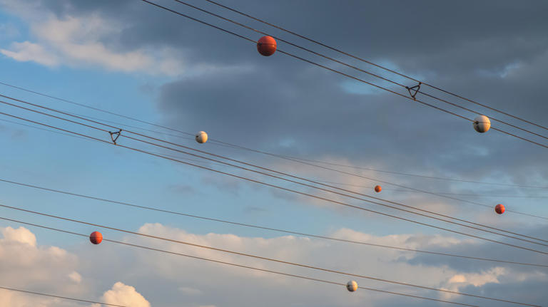 The reason power lines have orange balls is almost as interesting as ...
