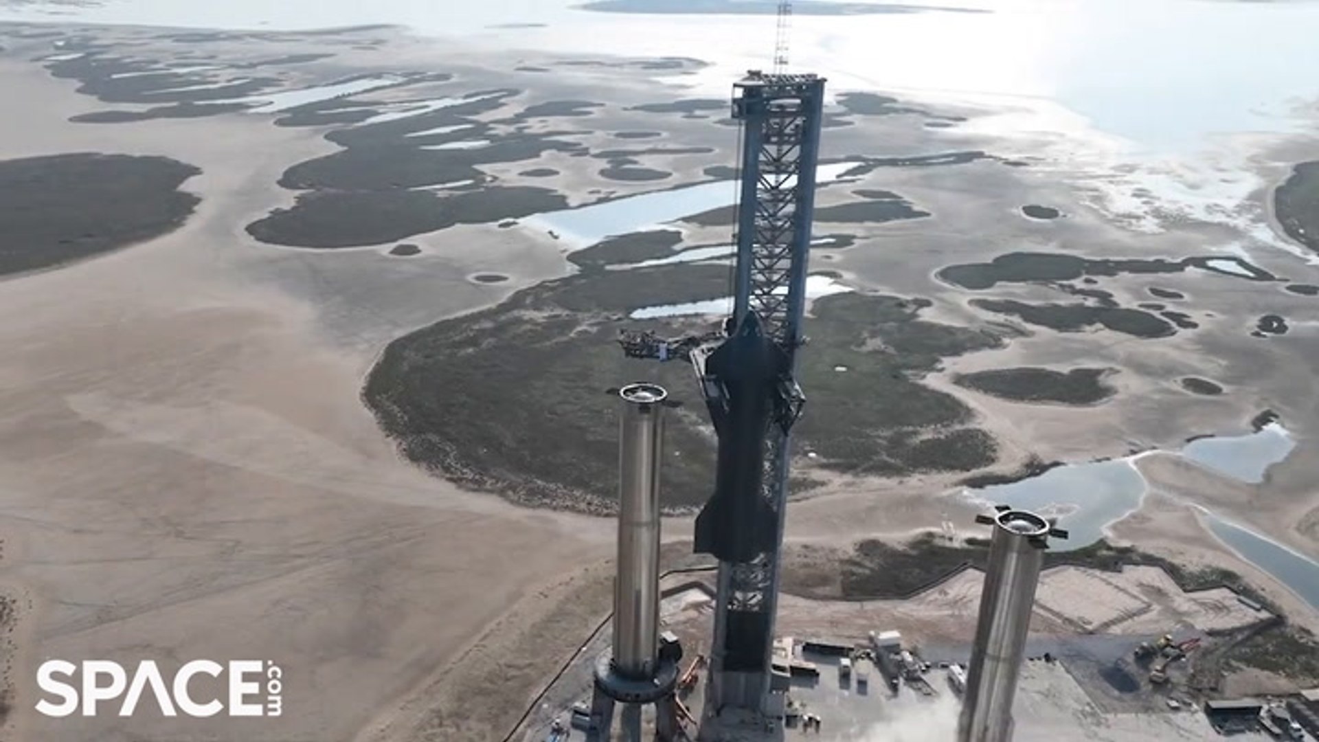 SpaceX stacking Starship 24 onto heavy booster in amazing drone video