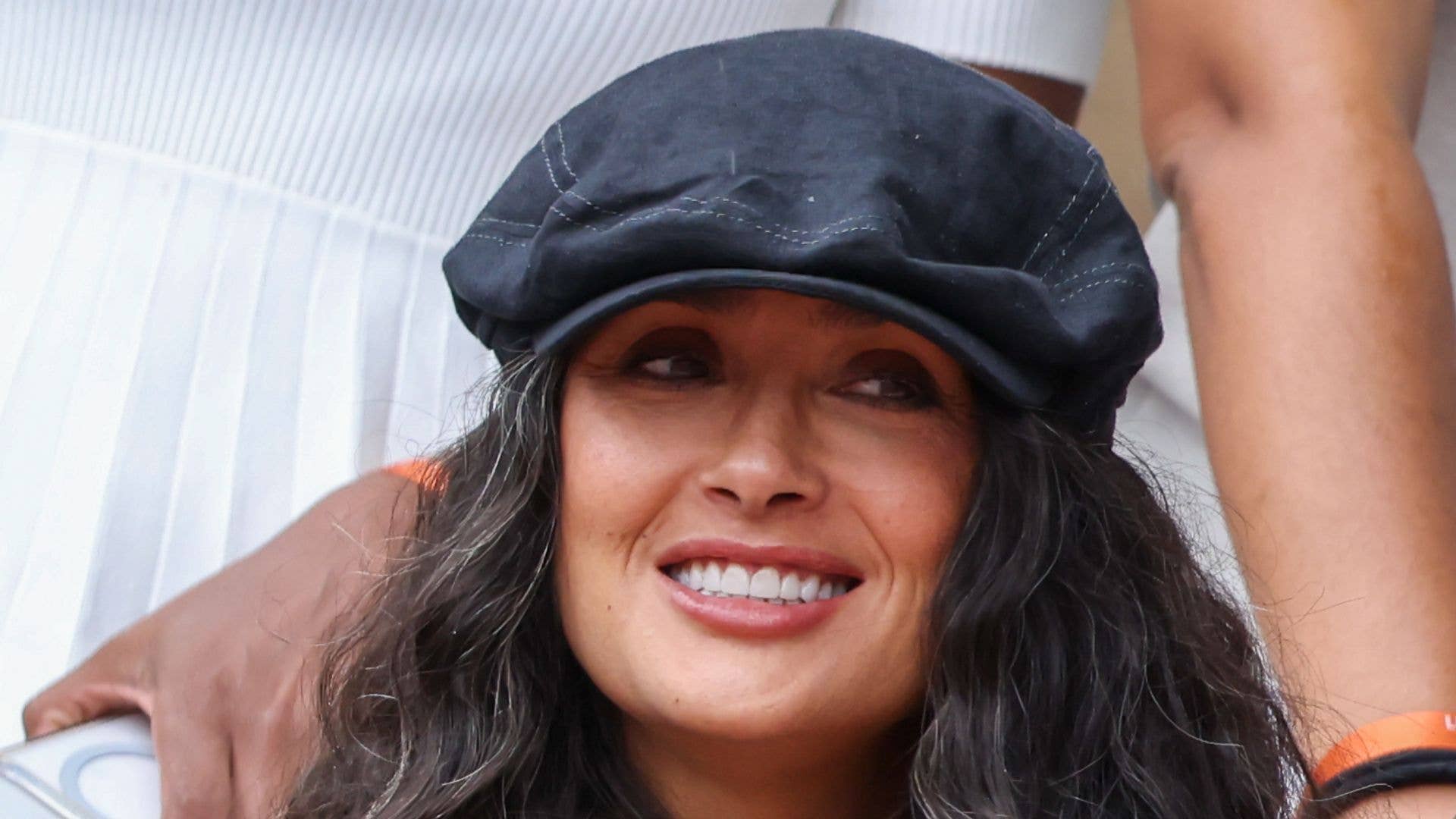 Salma Hayek rocks natural grays and twins in leather with husband ...