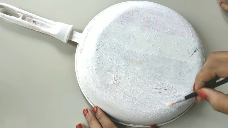 Don't toss an old cooking pan — make an adorable kitchen decor piece