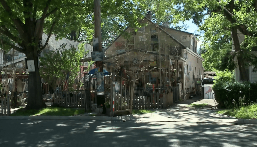 Woman rescued from vacant house fire where squatters lived in hoarder ...