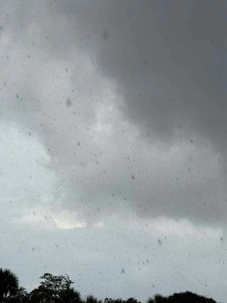 Funnel cloud forms near downtown Melbourne