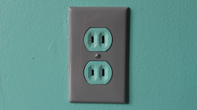 Why is one prong slot on electrical outlets bigger than the other?