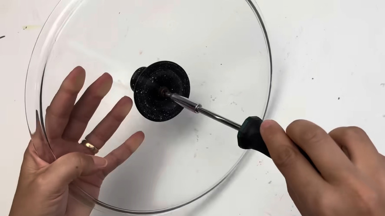 DIY clever countertop storage using an old pot lid and cup