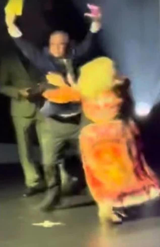 Crowd gasps as radio boss gropes presenter as she accepts award