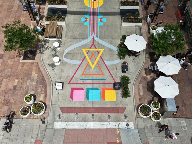 Artist completes new street mural on Larimer Square in Denver