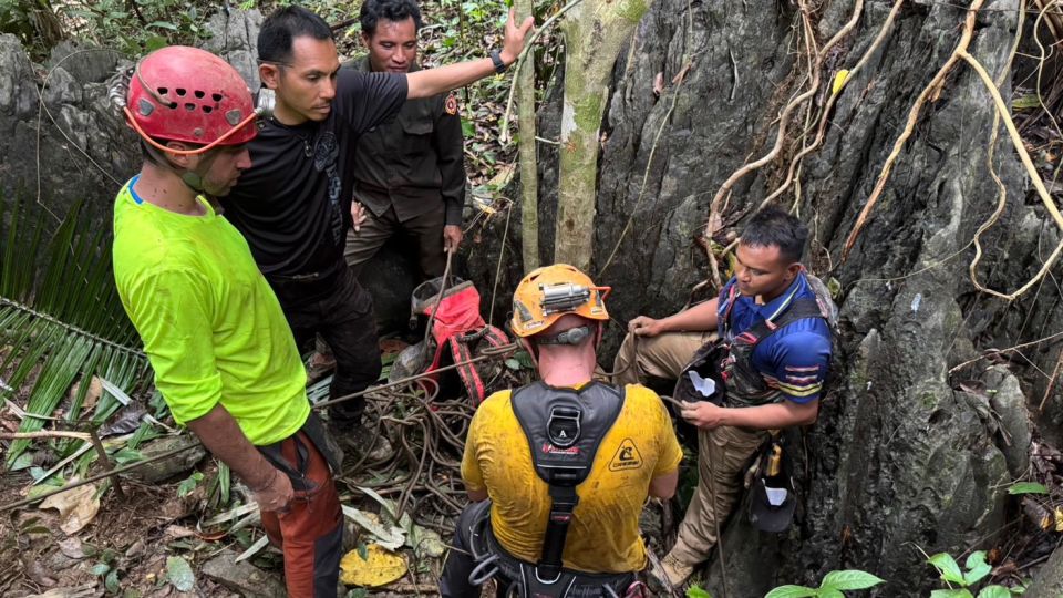 Rescuers search for new ways into cave in Laos where two men feared trapped
