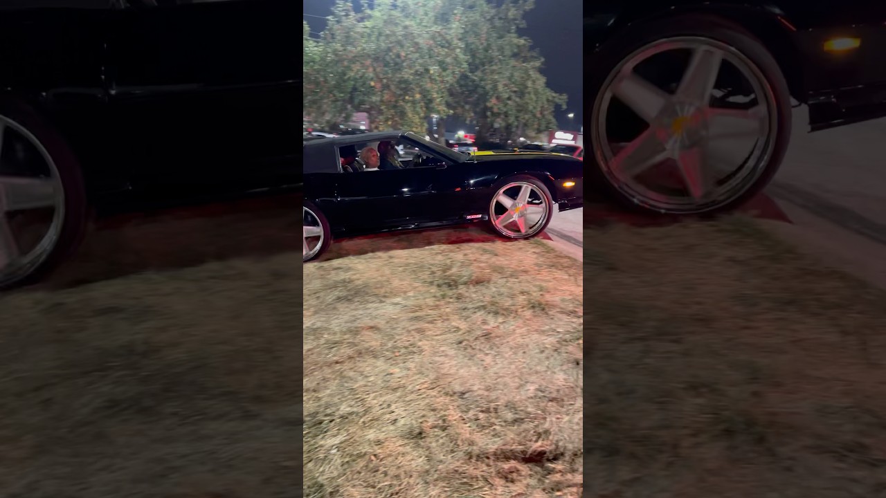 Black Chevy Camaro on 26’s Jumping up the Curb