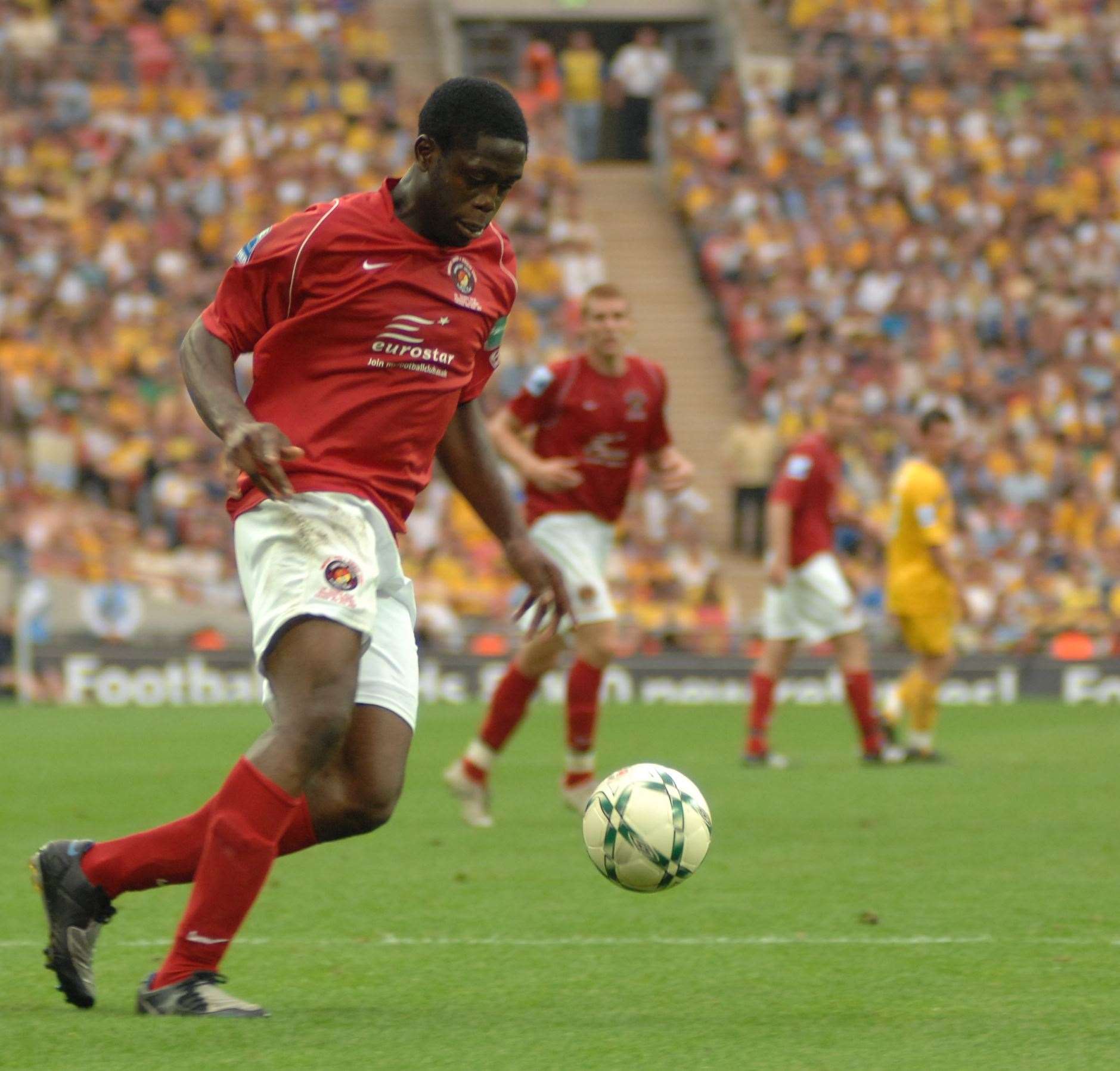 Former Gillingham striker and four-time promotion winner John Akinde ...